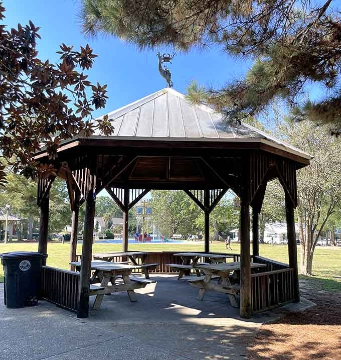 The charming gazebo provides welcome respite from Alabama sun while hosting countless birthday parties and family celebrations.