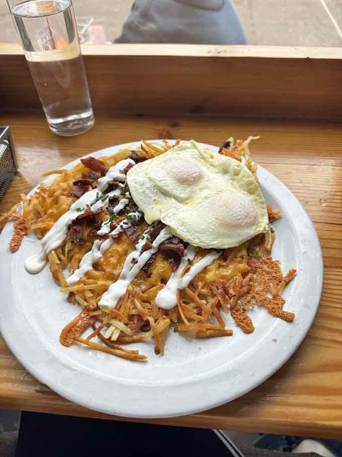 Loaded hash browns topped with a fried egg, because sometimes more is actually more, not less.