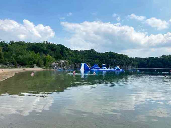 Scuba divers and swimmers sharing paradise, proving there's room for everyone in these pristine quarry waters.