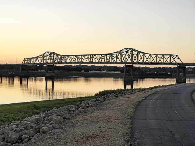 The bridge over the Mississippi at sunset creates the kind of view that makes you forget about your email inbox entirely.