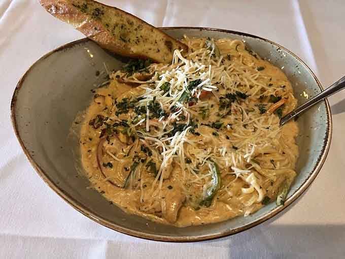 Cajun chicken pasta with garlic bread that'll warm you up faster than a Minnesota bonfire on a chilly evening.