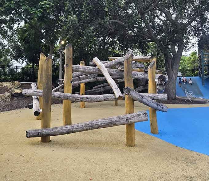 Natural log obstacles create a balance course that challenges coordination while keeping the nautical theme beautifully intact.