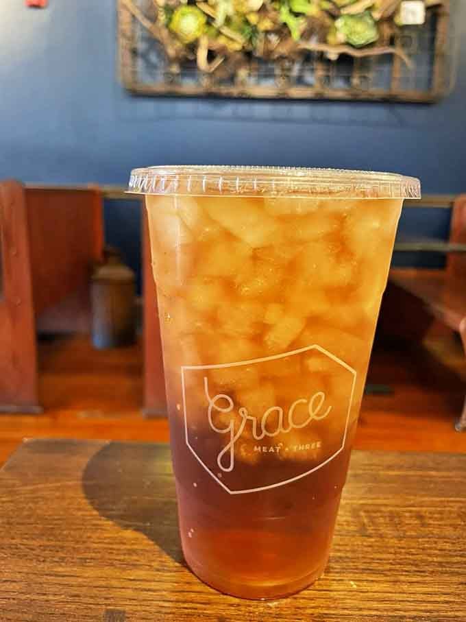 Sweet tea in a branded cup, because even your beverages deserve to look good at Grace Meat + Three.