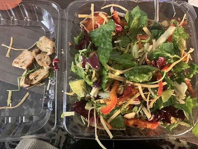 Fresh greens and grilled chicken proving that even bowling alleys can do salads right when they actually try hard.