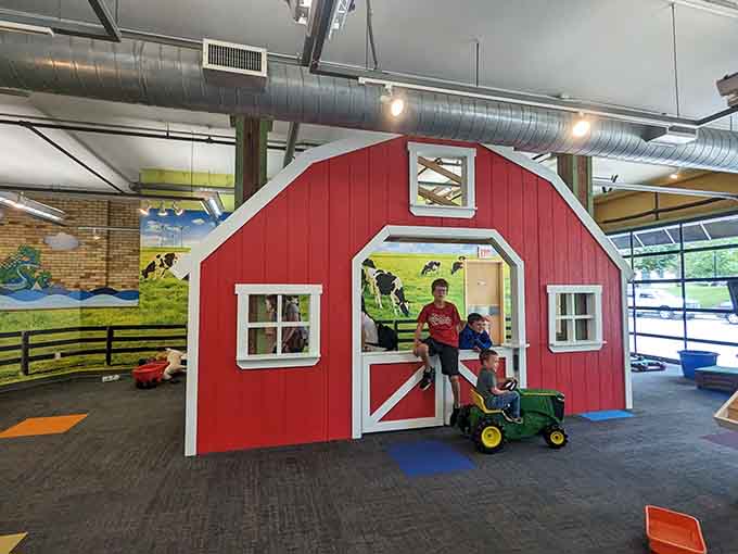 That classic red barn with white trim looks straight out of a Norman Rockwell painting, minus the actual livestock.
