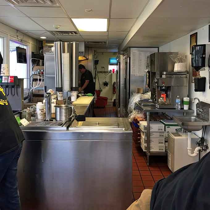 Behind the counter, burgers get built with the kind of focus usually reserved for surgical procedures.