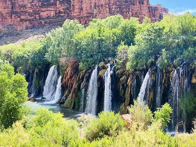Fifty Foot Falls spreads across the canyon like nature's curtain call, proving the best performances happen off the beaten path.