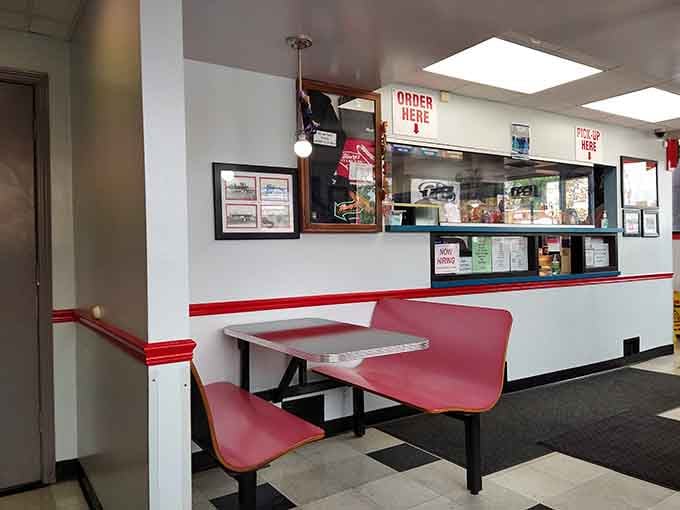 Pink booths and checkered floors: the kind of retro charm that never goes out of style, period.