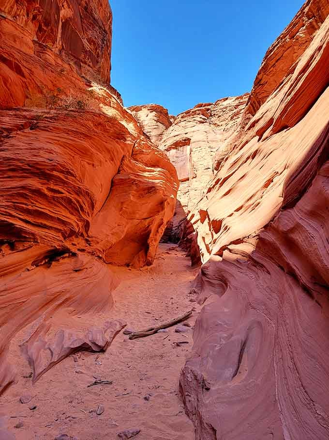 The slot canyon beckons with curves and colors that no artist could ever fully capture.