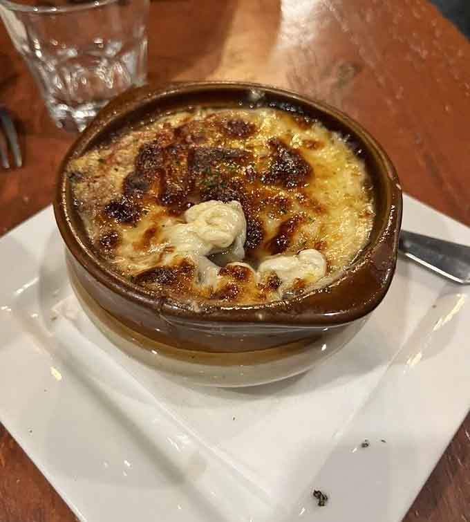 French onion soup with that perfectly caramelized cheese top that makes you wonder why anyone orders anything else.
