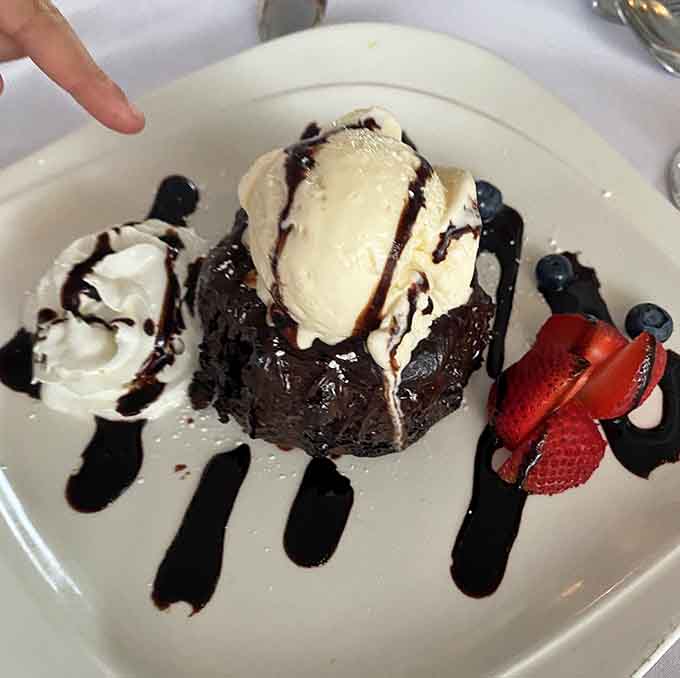 Warm lava cake with vanilla ice cream, because some desserts are worth loosening your belt for.