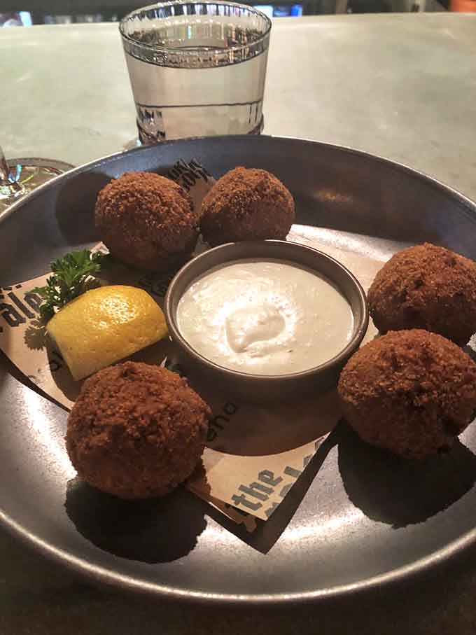 Crispy sauerkraut balls with creamy horseradish sauce make the perfect shareable appetizer, though sharing might prove emotionally difficult.
