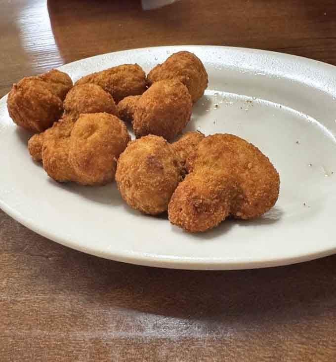 Fried mushrooms with that perfect golden-brown exterior that promises crispy, savory satisfaction in every bite.