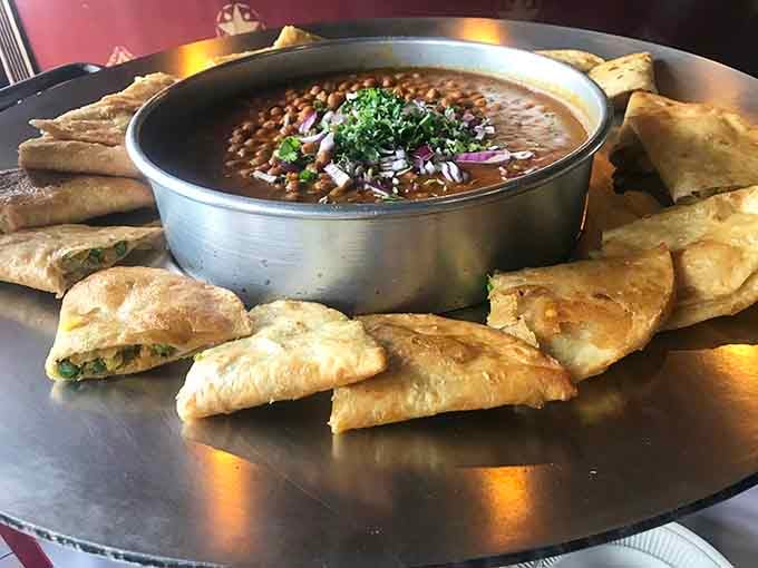 Open samosas surrounding creamy dal like edible spoons, which is basically the most genius appetizer concept ever invented.