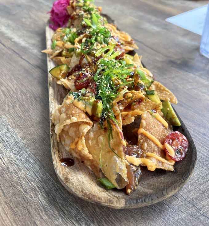 Poke nachos on a wooden board, because fusion food should be fun, creative, and absolutely worth sharing.