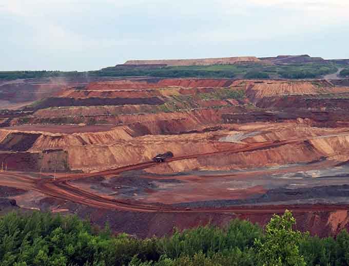Those rust-red terraces aren't just pretty; they're the iron ore that literally built America's skyline and infrastructure.