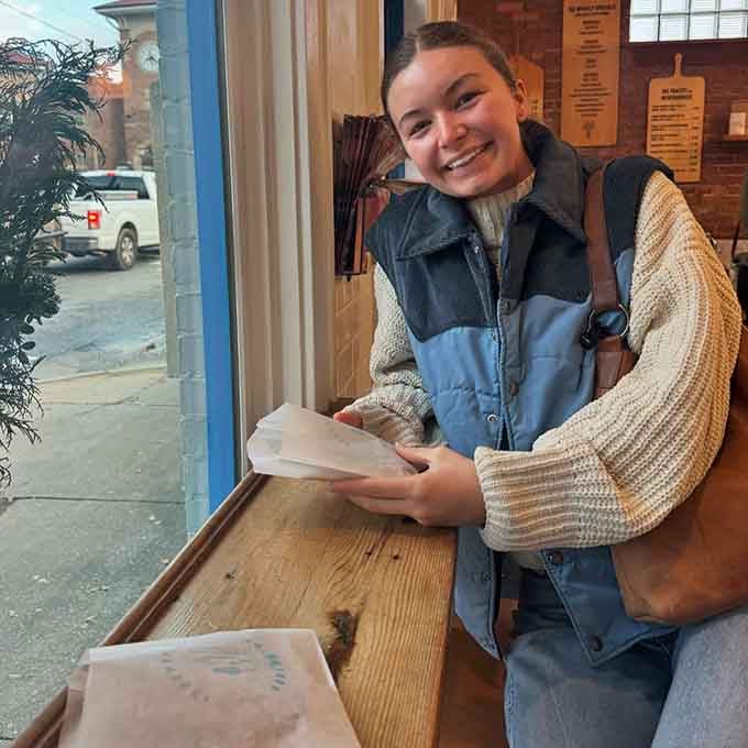 When customers smile like this while holding their bakery bags, you know something magical is happening inside those walls.