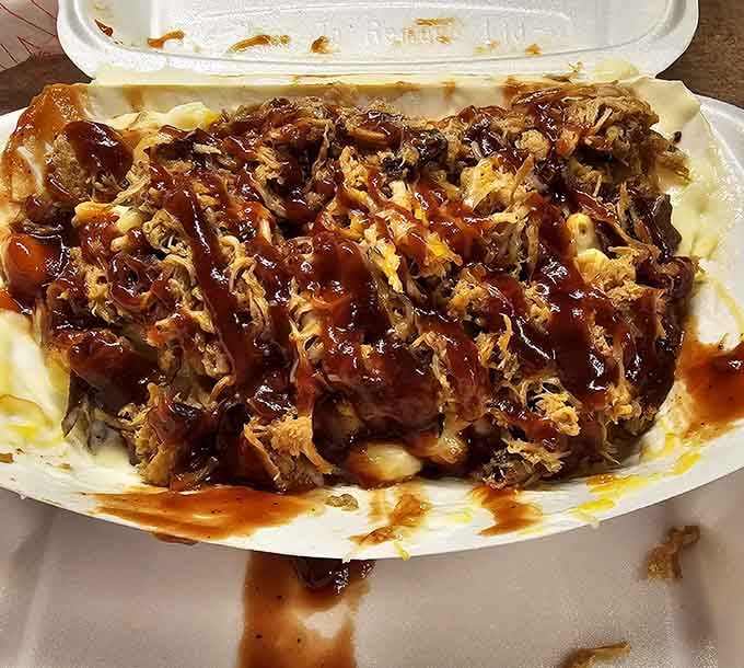 Pulled pork swimming in sauce over mac and cheese is the kind of indulgence that makes life worth living.