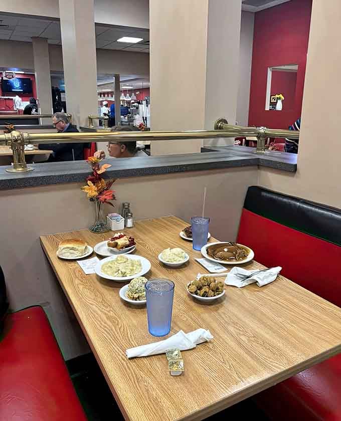 Tables loaded with multiple plates prove that cafeteria-style dining encourages the beautiful sin of over-ordering with zero regrets.