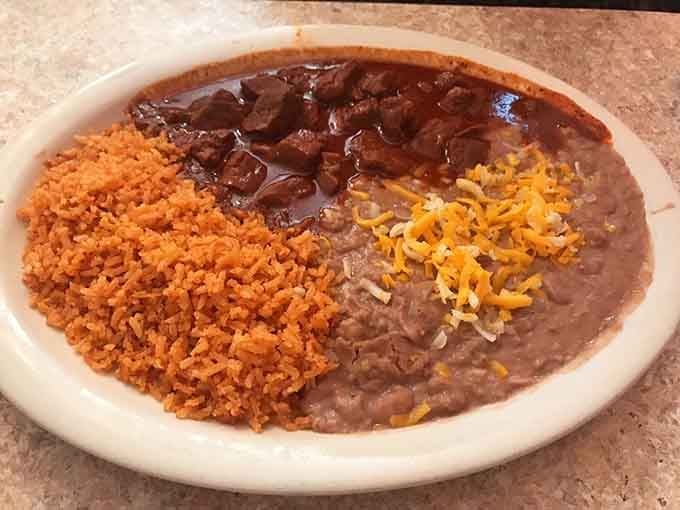 Chile Colorado with rice and beans, comfort food that warms you from the inside out on any day.