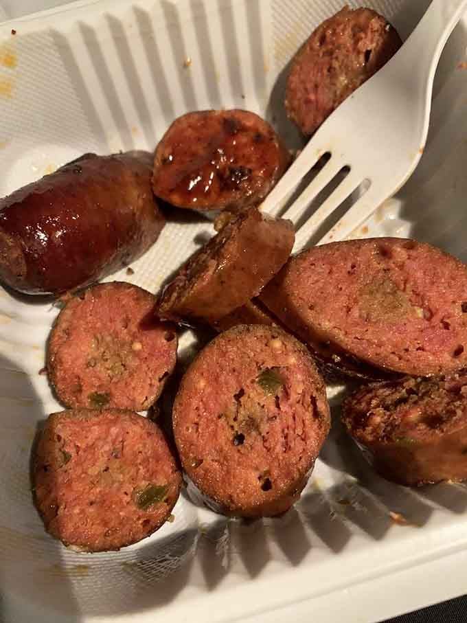 Smoked sausage sliced thick with that satisfying snap reminds you why barbecue joints always include links on the menu.