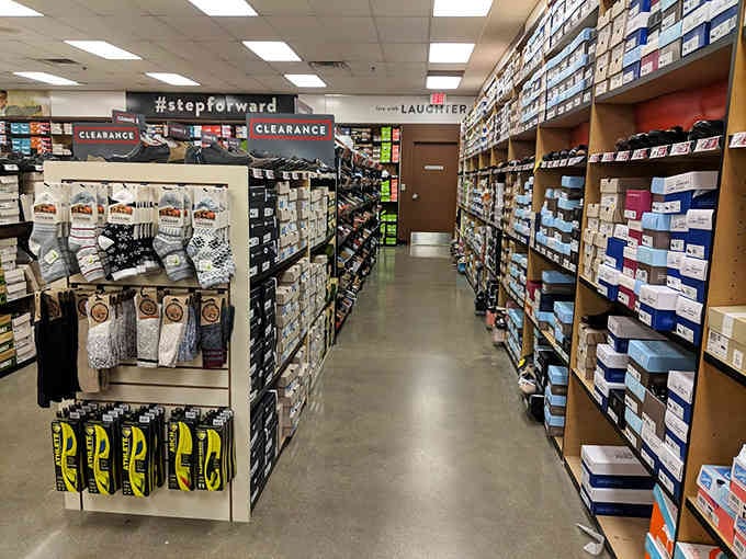 Socks organized by category like a well-planned library, because even your feet deserve discounted luxury and proper organization.