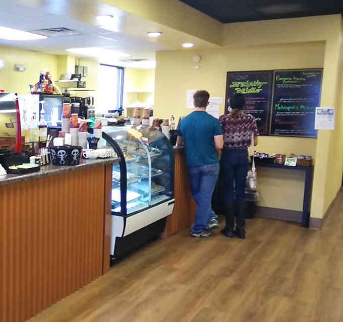 The counter where coffee dreams come true and comic book debates are settled over perfectly pulled espresso shots.