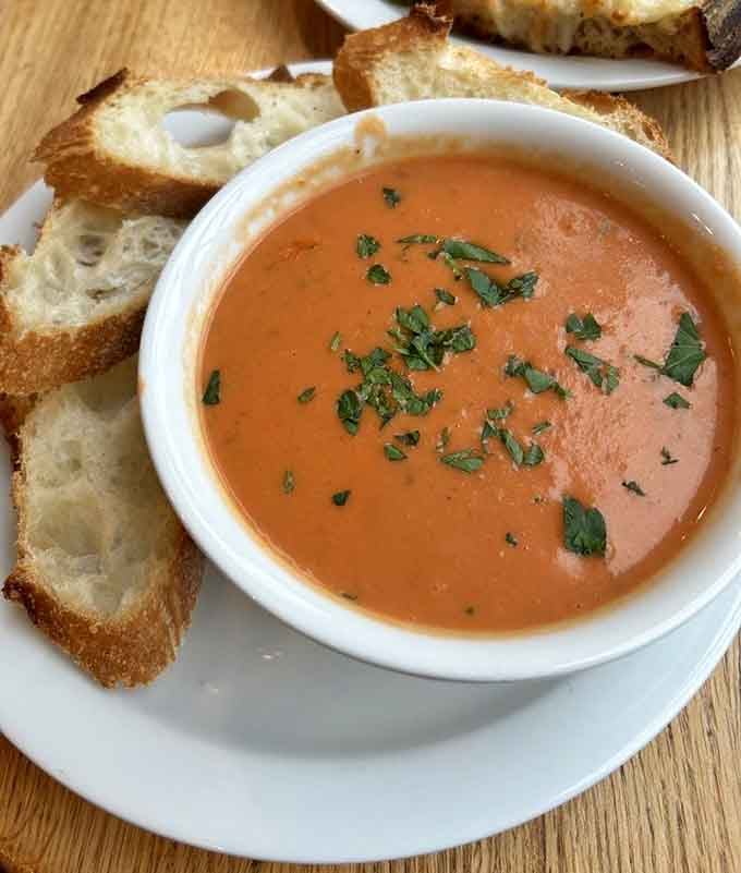 Tomato soup with bread for dunking, because some combinations are simply meant to be together forever.