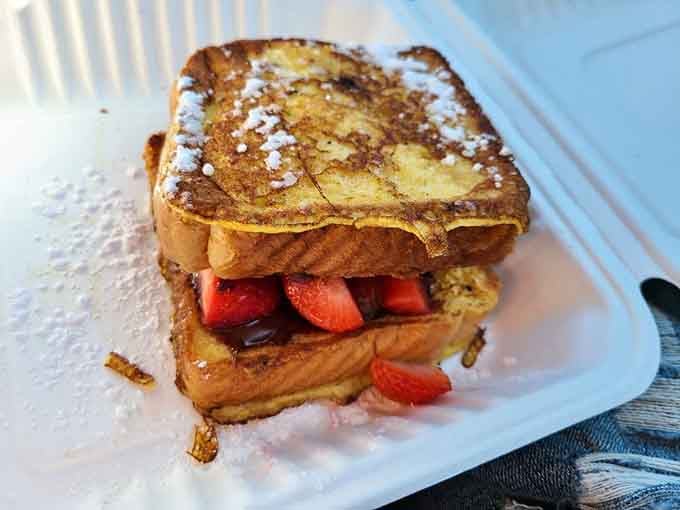 Nutella-stuffed French toast with fresh strawberries, making every other breakfast option suddenly seem inadequate by comparison.
