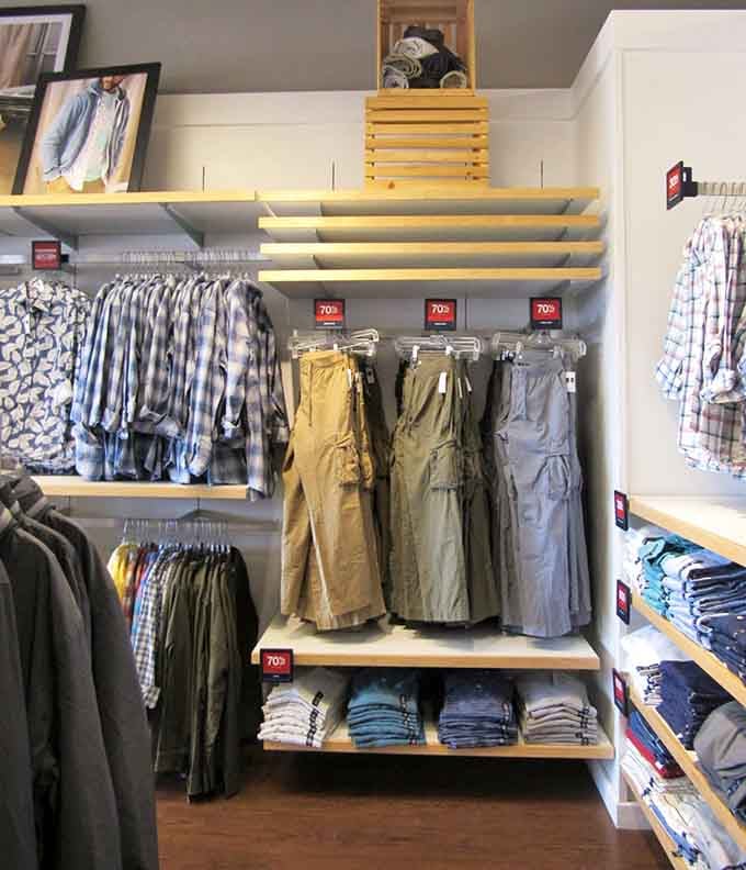 Men's clothing organized with the precision of a military operation, proving that looking sharp doesn't require draining your wallet dry.