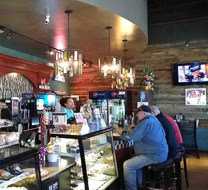 The bar area buzzes with friendly conversation while the bakery case tempts every passerby shamelessly.