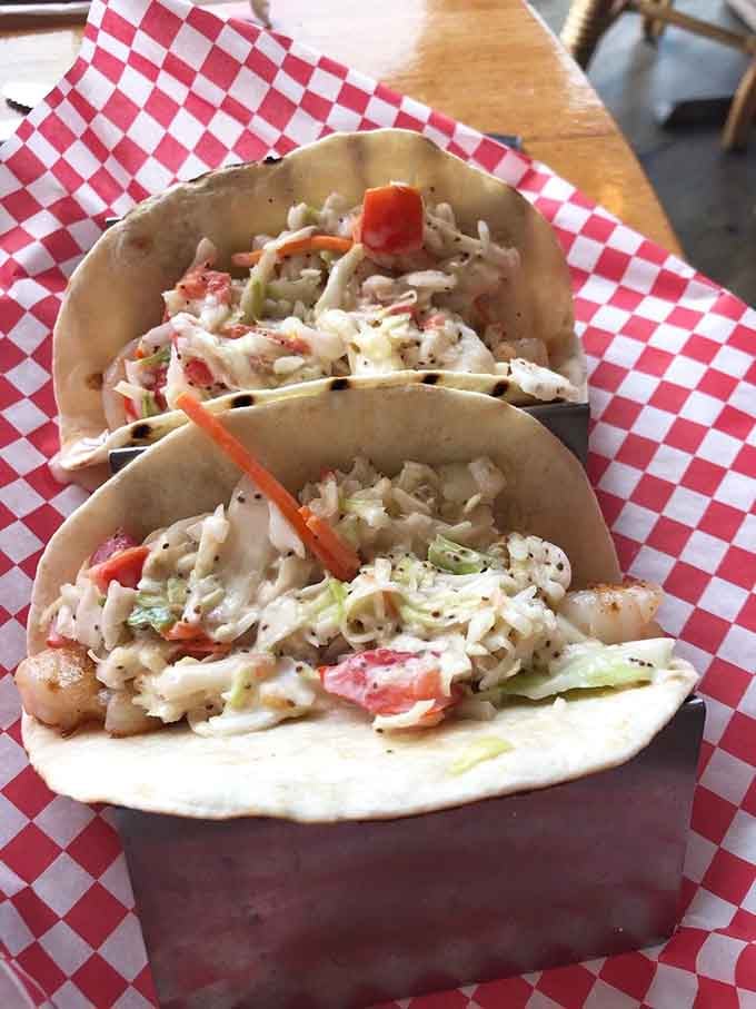 Fresh fish tacos topped with crunchy slaw on soft tortillas deliver beachside flavor without the sand.