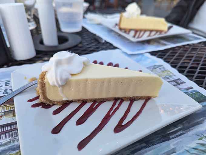 Key lime pie sits pretty with chocolate drizzle, proving Klein's takes dessert as seriously as their main attractions.
