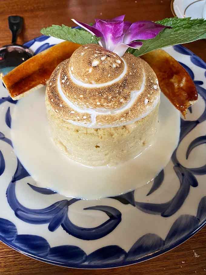 Tres Leches cake with its torched meringue top looks like a tiny edible volcano of sweet, creamy happiness.