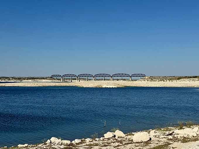 The old railroad bridge photobombing this gorgeous lake view adds character to an already stunning scene.