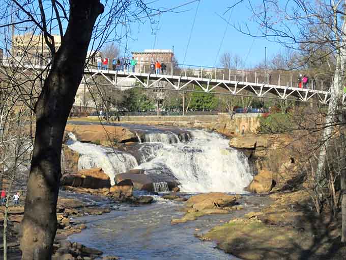 This bridge offers waterfall views without getting wet, perfect for those who prefer their nature slightly more civilized.