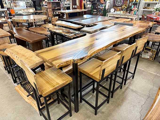 Live-edge wood tables paired with industrial stools create that perfect blend of rustic charm and modern sophistication everyone craves.