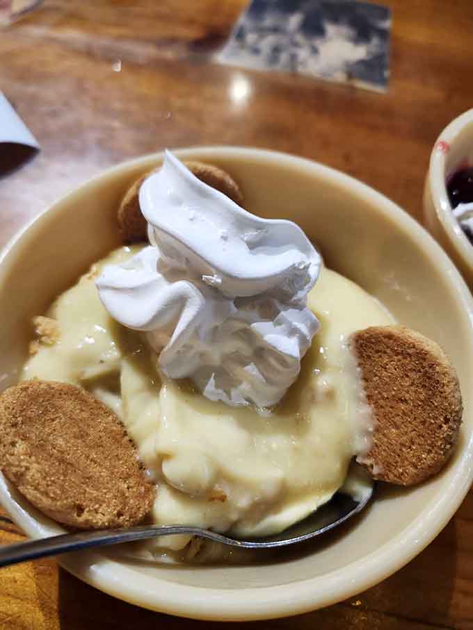 Banana pudding topped with meringue peaks that would make any church potluck organizer weep with joy and a little professional envy.