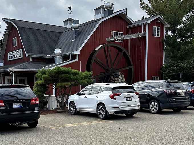 Past Tense Cider Mill's red barn exterior screams Michigan autumn louder than any pumpkin spice latte ever could dream.