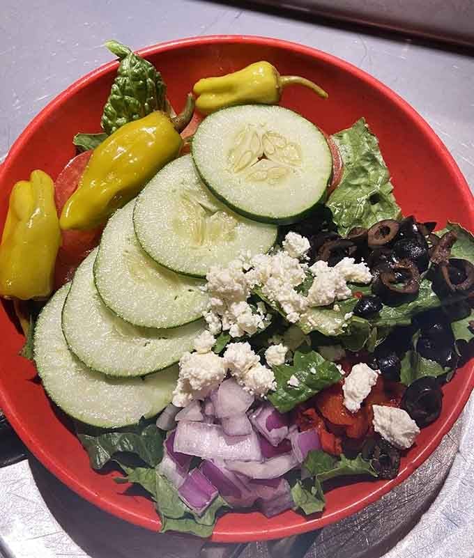 Fresh vegetables arranged like edible art, proving Lazy Moon takes salads seriously despite their pizza-centric reputation.