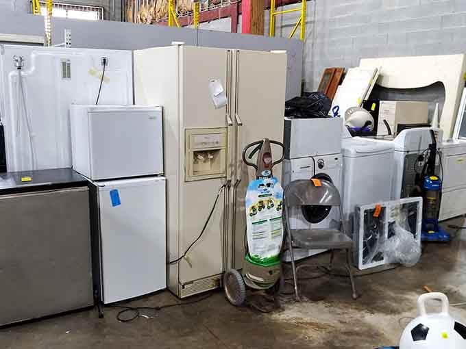 Refrigerators and appliances lined up like they're auditioning for a second chance at domestic stardom.