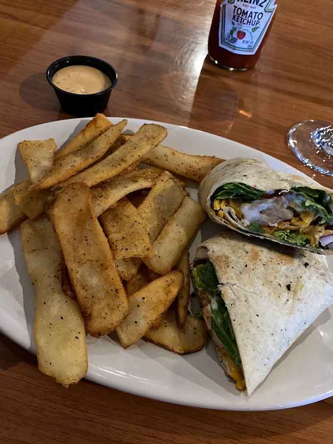 That wrap packed with fresh ingredients shows Low Tide takes every menu item seriously, not just the steaks.