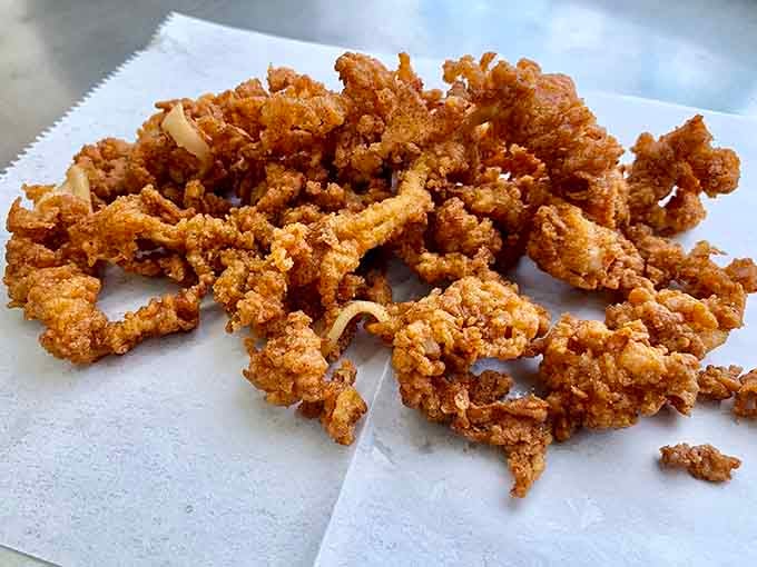 Those crispy clam strips have the kind of golden coating that crackles with each bite, delivering pure fried satisfaction.