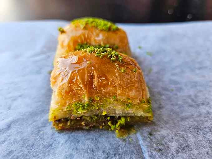 Flaky baklava layers glistening with honey and pistachios, because sometimes you need sweetness to complete the experience.