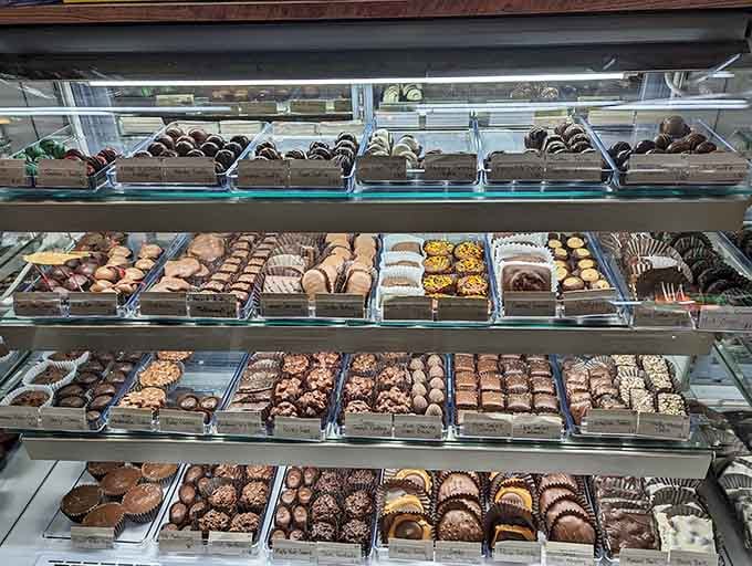 Row after row of handcrafted chocolates that make choosing just one flavor feel like an impossible mission you're happy to accept.
