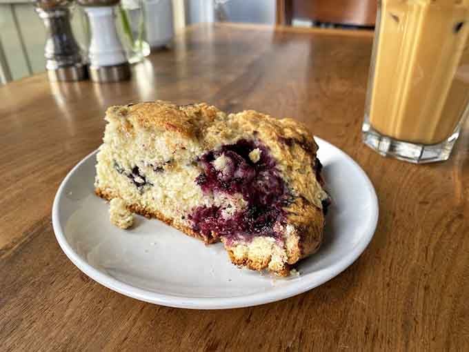 That fresh-baked scone with its jammy center is basically a warm hug you can eat with butter.