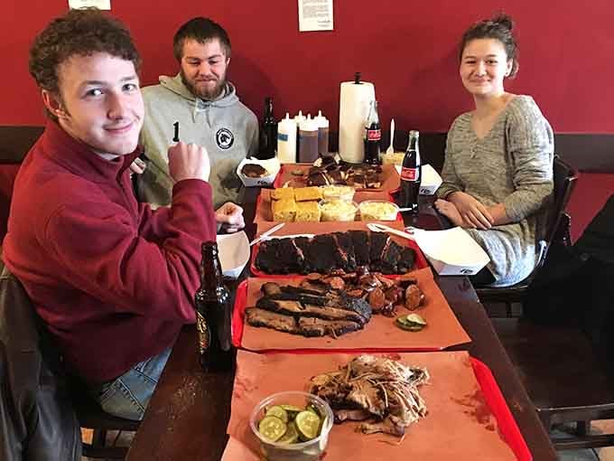 The smiles say it all: this is what happens when good people gather around even better barbecue.