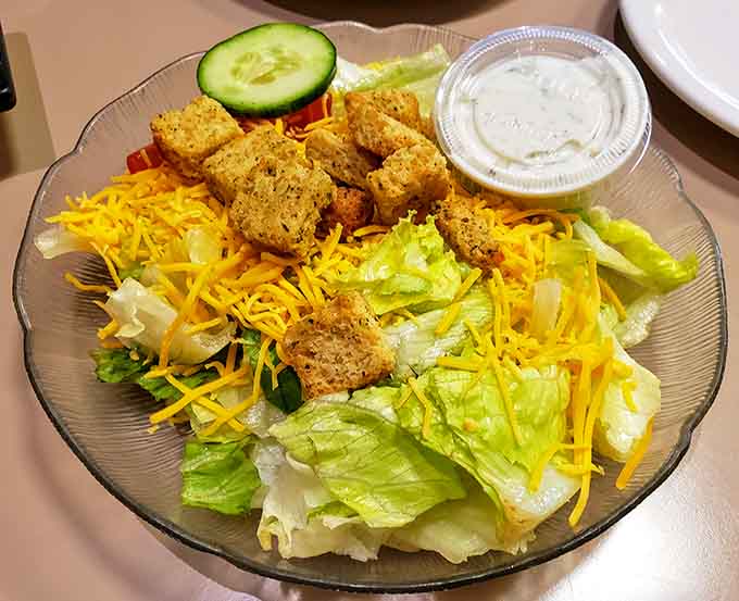 Fresh salad topped with crispy chicken bites&mdash;proof that eating your greens doesn't have to feel like punishment.