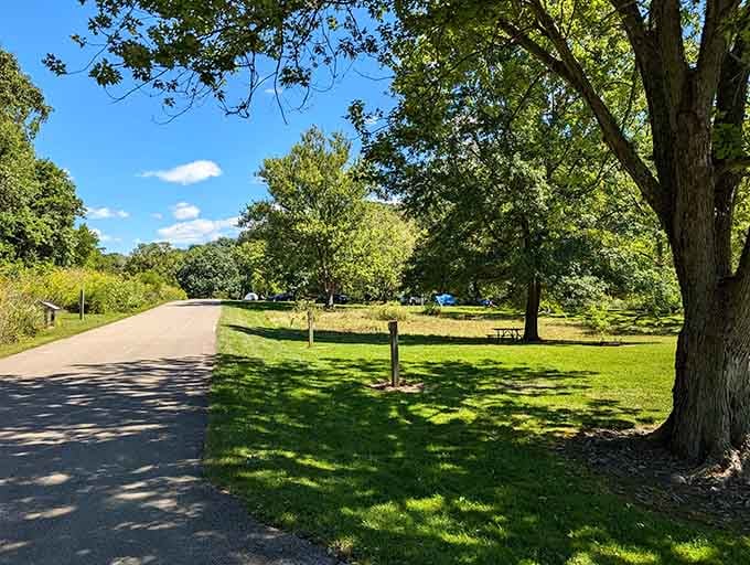 Manicured campground paths wind through shaded areas, offering the perfect blend of civilization and wilderness for weekend warriors.