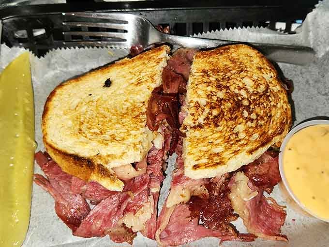 That towering Reuben sandwich is stacked higher than ghost stories, with corned beef that'll make you believe in miracles.